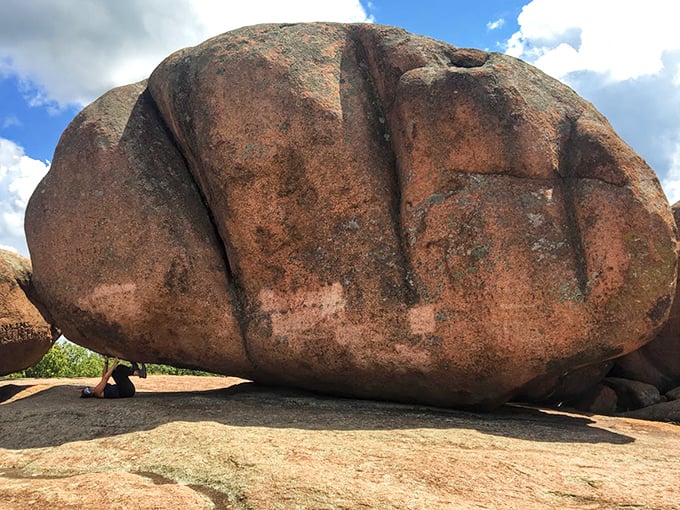 The same massive boulder from another angle, showing just how dwarfed we humans are next to these geological celebrities that have been posing for photos since before cameras existed.