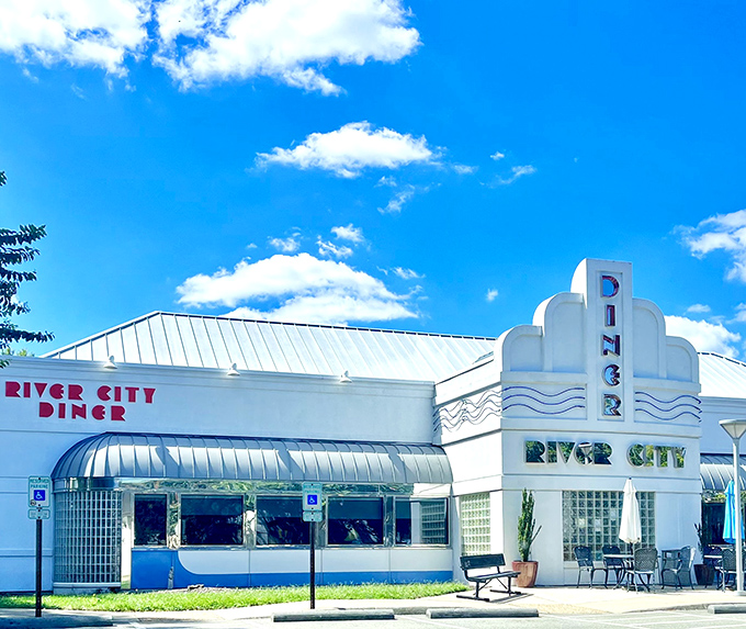 The classic white exterior with its red and blue awning stands like a time capsule in Midlothian, promising comfort food treasures within.