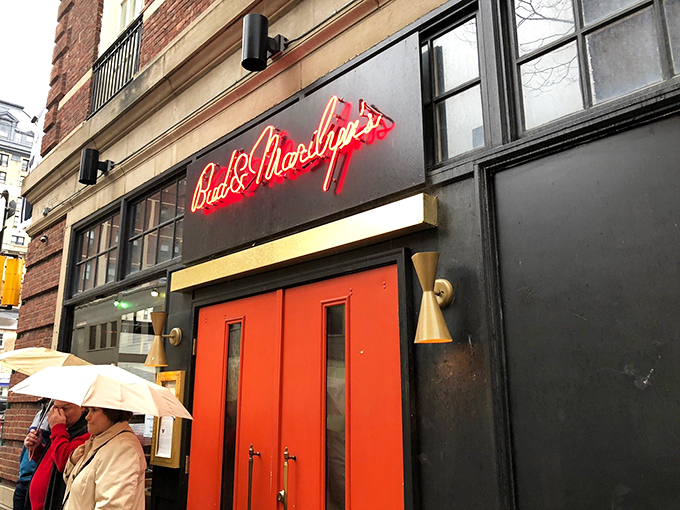 That classic red neon glow promises serious comfort food hiding behind those welcoming doors.