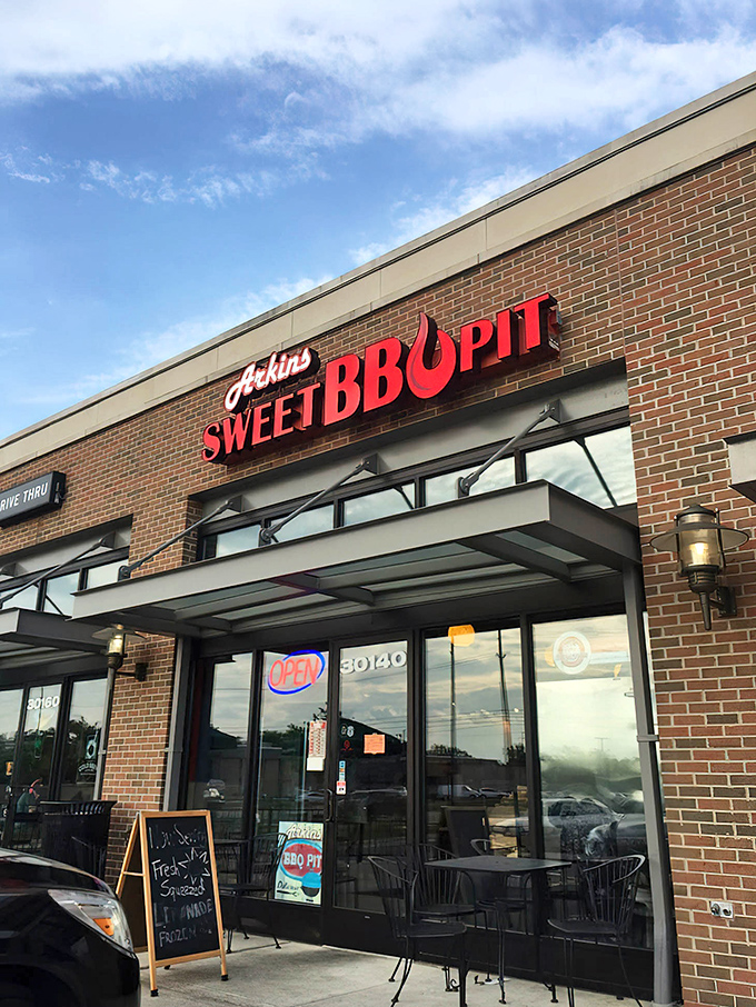 The red signage against brick isn't just decoration&mdash;it's a beacon calling to barbecue pilgrims seeking smoky salvation in Southfield.