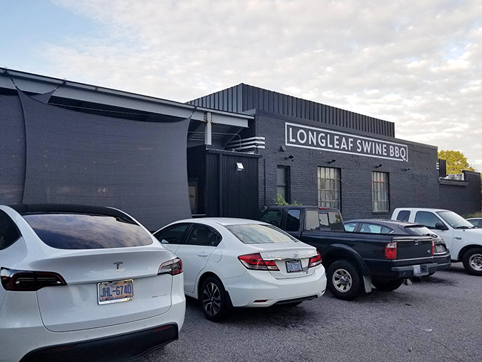 Parked cars outside hint at the treasure within &ndash; like finding a speakeasy for smoked meat enthusiasts in this modest Raleigh building.