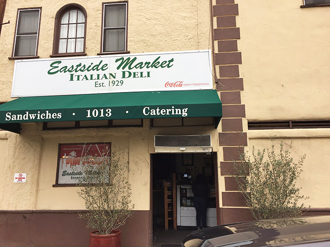 The unassuming facade of Eastside Market Italian Deli, where culinary magic has been happening since 1929. Some buildings wear their history like a comfortable sweater.