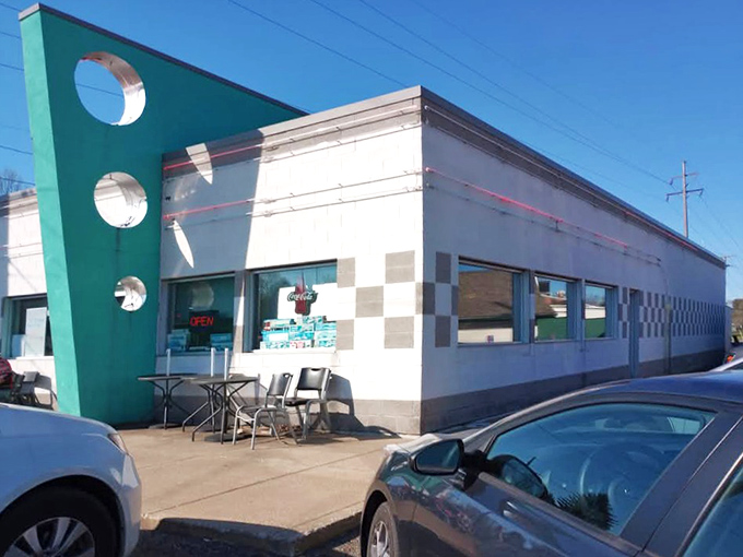 The turquoise fin-like accent wall isn't just architectural flair&mdash;it's a time machine disguised as a diner. Welcome to retro paradise.
