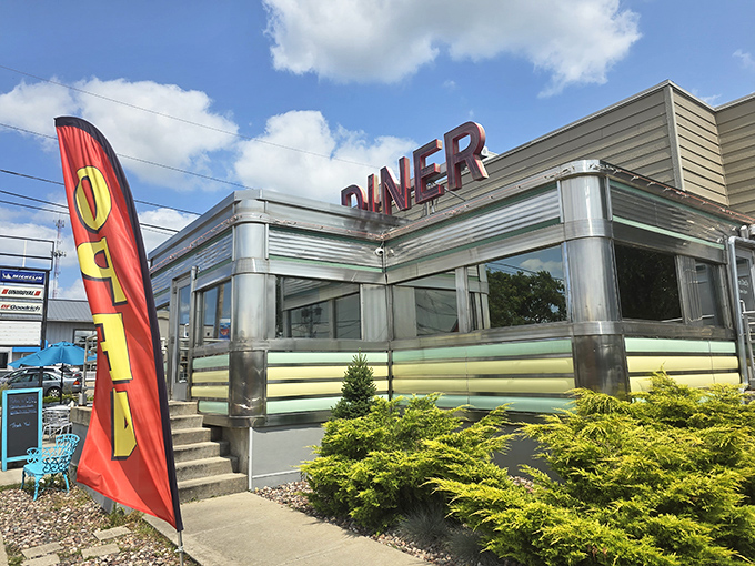 The gleaming stainless steel exterior of Broadway Diner shines like a beacon of hope for hungry travelers. This classic roadside architecture promises delicious comfort inside.