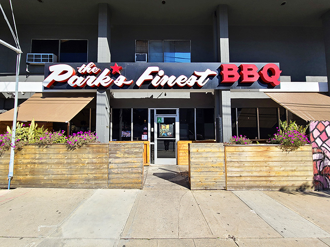 The unassuming storefront of The Park's Finest beckons with its simple wooden patio barriers and bold signage&mdash;proof that culinary treasures often hide in plain sight.