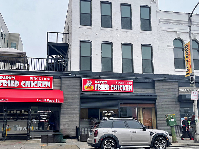 The unassuming storefront of Park's Fried Chicken stands like a beacon of culinary promise on North Paca Street, its bold red signage a siren call to fried chicken aficionados.
