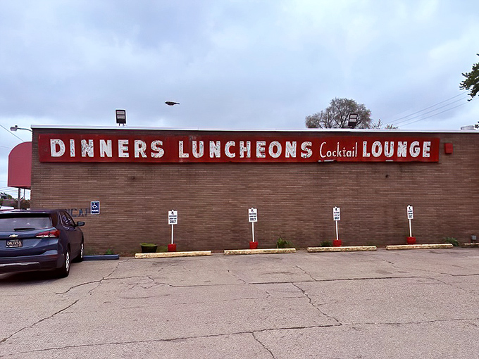 The unassuming exterior of Loui's Pizza proves once again that the best food experiences often hide behind the most modest facades.