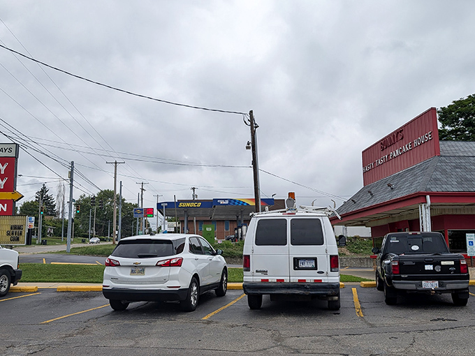 Even on cloudy days, this crimson breakfast sanctuary draws a loyal crowd of hungry patrons seeking refuge from the world of green smoothies and avocado toast.