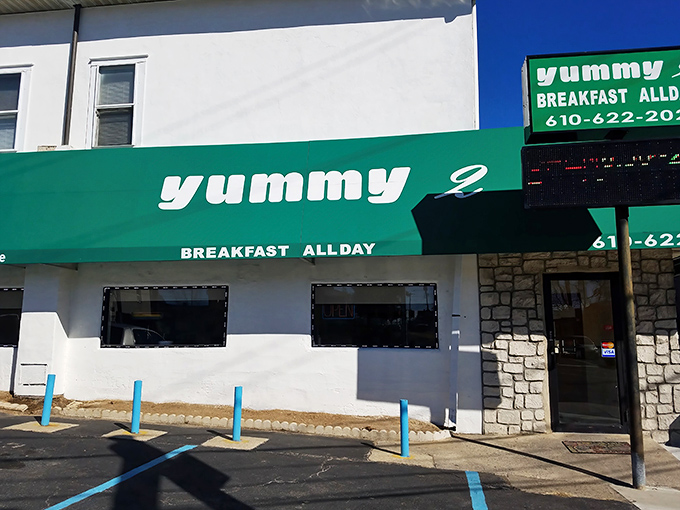 The unmistakable green awning of Yummy 2 promises "BREAKFAST ALLDAY" &ndash; a commitment to morning magic that deserves a standing ovation.