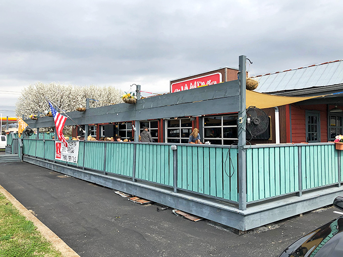 Champy's distinctive turquoise fence and bright red sign create the perfect first impression&mdash;like a beacon calling all fried chicken enthusiasts home.