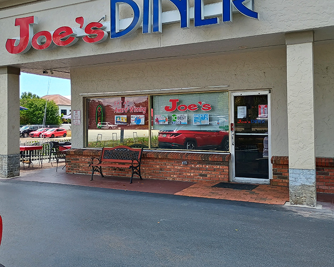 The unassuming storefront of Joe's Diner might not scream "culinary destination," but locals know this Naples treasure hides breakfast magic behind those brick walls.