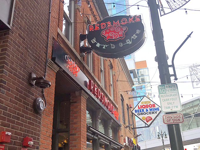 That glowing red neon pig sign isn't just decoration&mdash;it's a beacon of hope for the barbecue-deprived souls wandering through Detroit's historic Greektown.