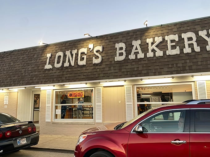 The unassuming brick exterior of Long's Bakery belies the magic happening inside. Culinary treasures rarely announce themselves with neon signs.
