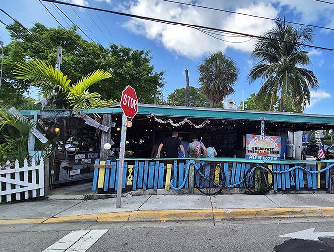 Where the sidewalk meets seafood paradise. That blue fence isn't keeping people out&mdash;it's barely containing all the flavor waiting inside.