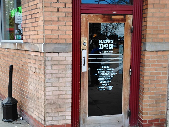 The unassuming brick entrance with its wooden door and "HAPPY DOG" lettering promises what every great food adventure should: delicious surprises behind an ordinary facade.