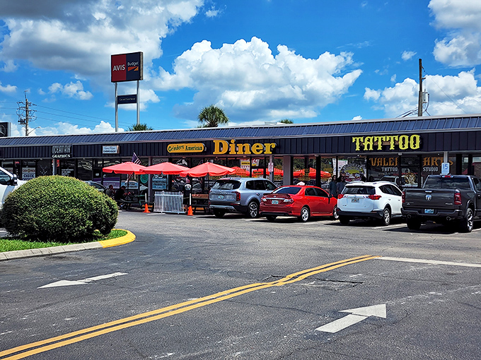 Strip mall treasure hunting at its finest! Grinder's exterior might be unassuming, but those red umbrellas and packed parking lot tell the real story.