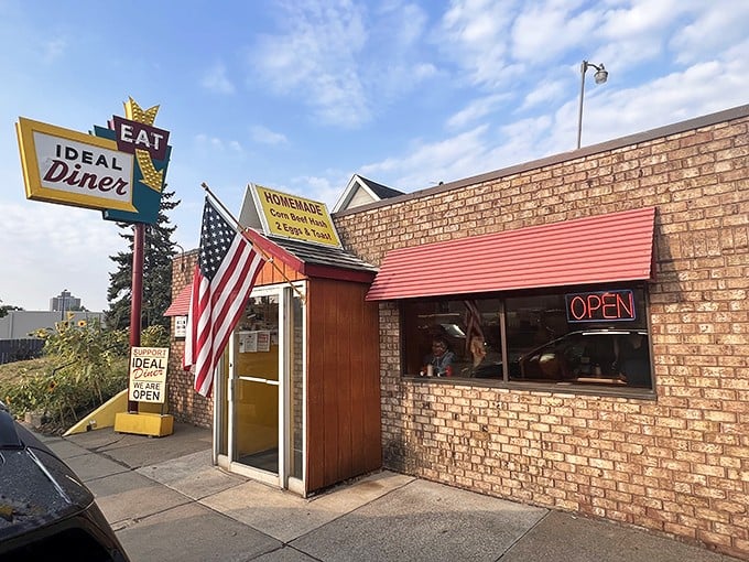 The iconic Ideal Diner sign stands proudly against the Minnesota sky, promising breakfast salvation to hungry Northeast Minneapolis residents since long before brunch became trendy.