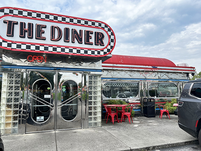 Chrome gleaming under Tennessee sunshine, The Diner's iconic red roof and checkerboard sign promise a time-traveling feast that delivers on nostalgia and flavor alike.