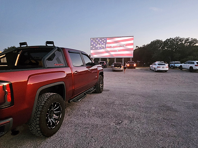 American nostalgia at its finest&mdash;where pickup trucks and patriotism meet under the glow of a massive outdoor screen.