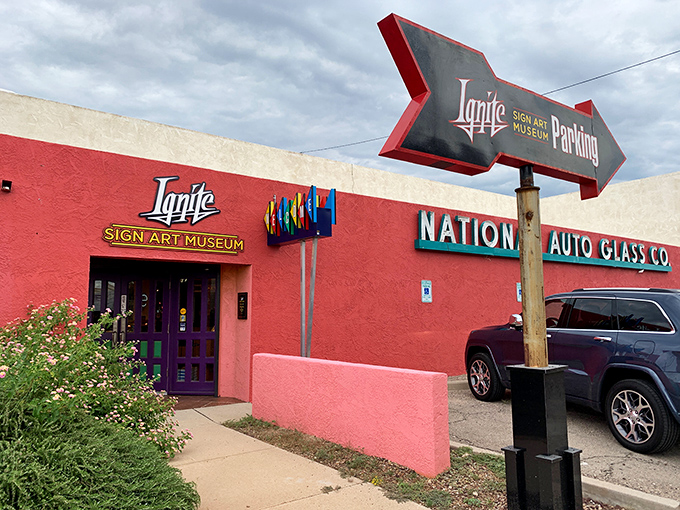 The vibrant pink exterior of Ignite Sign Art Museum beckons like a neon-lit oasis in the Tucson desert, promising illuminated treasures inside.