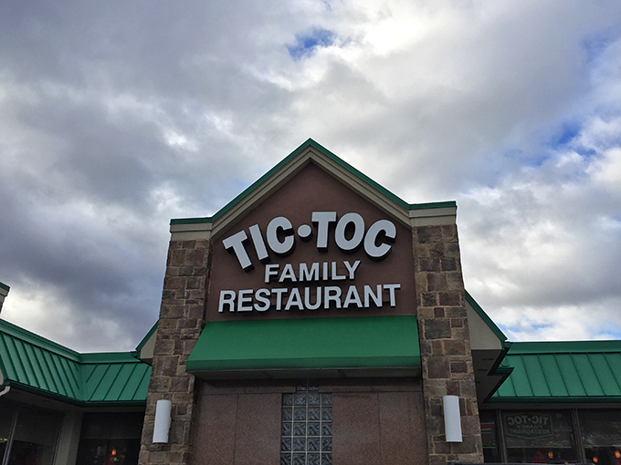 The iconic green-roofed stone facade of Tic-Toc Family Restaurant stands ready to welcome hungry travelers. Time really does stand still for good food.