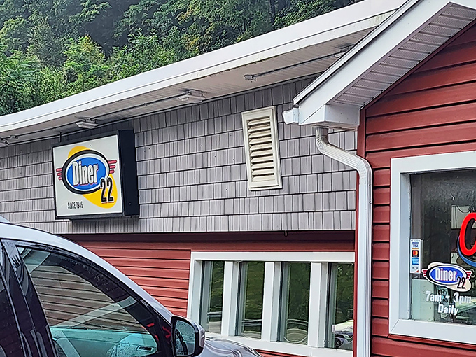 The iconic blue and yellow Diner 22 sign beckons hungry travelers like a lighthouse for the breakfast-starved.
