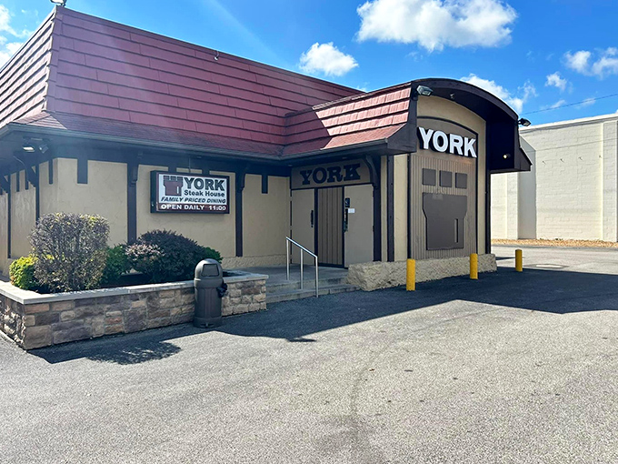 The unassuming exterior of York Steak House stands like a culinary time capsule on West Broad Street, promising nostalgic delights within its medieval-inspired walls.