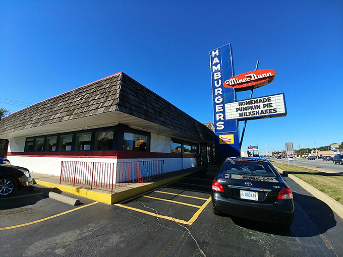 That iconic neon sign beckons like a lighthouse for hungry travelers. Miner-Dunn's vintage charm hasn't changed since your parents had their first date here.