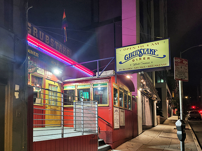 Like a neon-lit time machine on Pine Street, Grubstake's converted railway car promises late-night salvation for hungry souls until 4 AM.