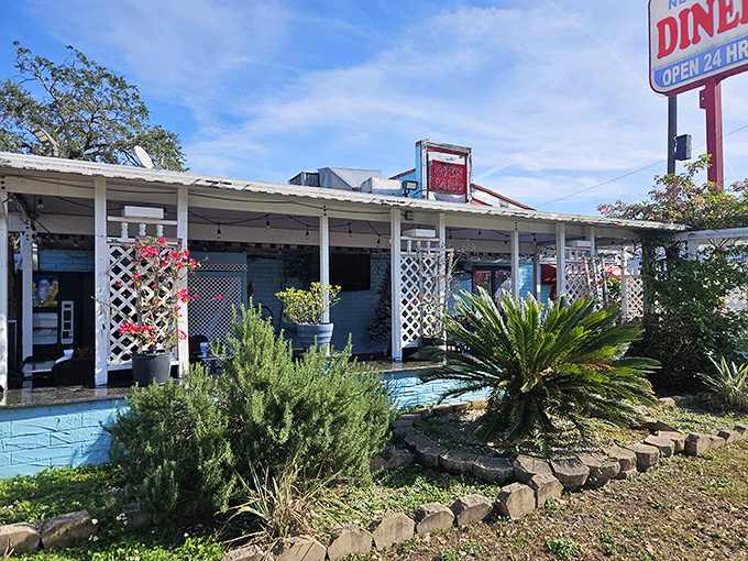 The light blue exterior with white lattice feels like Florida's answer to a New York diner &ndash; tropical plants included, no winter coat required.