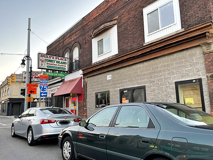 The unassuming brick exterior of Duly's Place stands as a Detroit landmark, where coney dreams come true regardless of the weather outside.