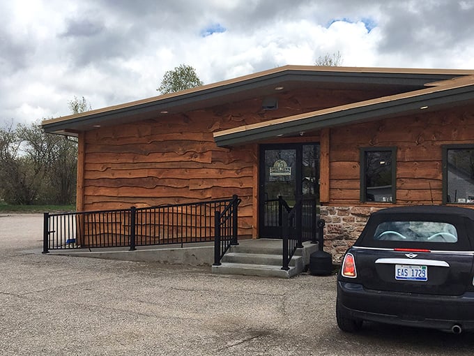 The rustic log cabin exterior of Trout Town Tavern welcomes you like an old friend who happens to make the best prime rib in three counties.