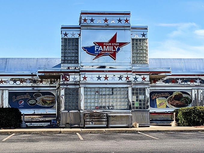 The gleaming chrome exterior of Four Star Family Restaurant stands like a time portal to the 1950s, complete with a constellation of stars that promise stellar dining.