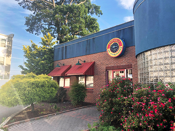 Those red awnings and vibrant landscaping aren't just for show—they're your first clue that flavor lives here.