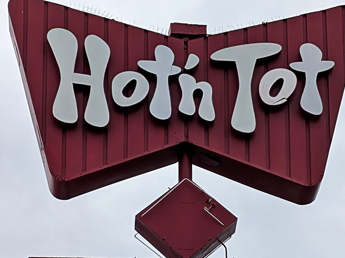 That retro sign isn't just decoration&mdash;it's a time machine. Hot N Tot's distinctive bowtie logo has been guiding hungry travelers to breakfast nirvana for generations.