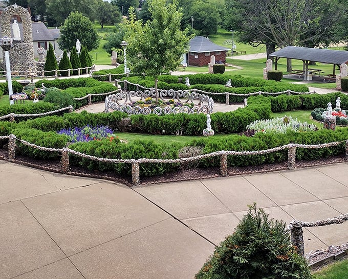 Meticulously crafted stone pathways wind through manicured gardens, where every pebble seems to have found its perfect home in this Wisconsin wonderland.
