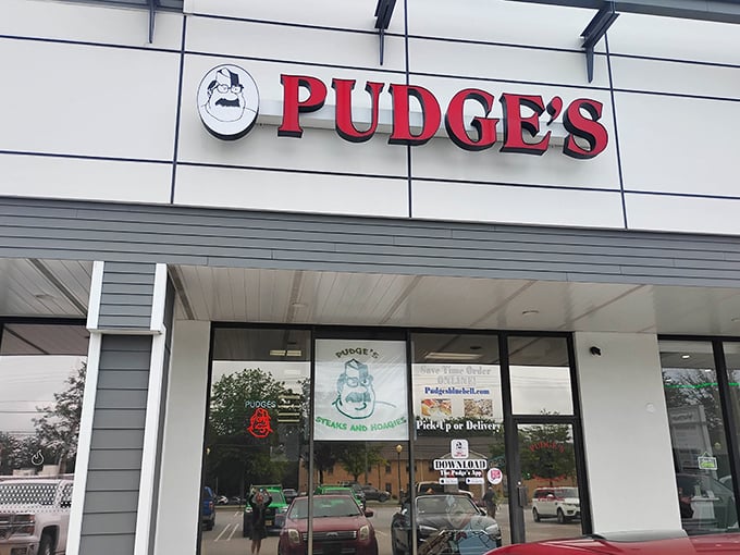 The iconic red Pudge's sign welcomes hungry visitors like a beacon of sandwich salvation in Blue Bell's suburban landscape.