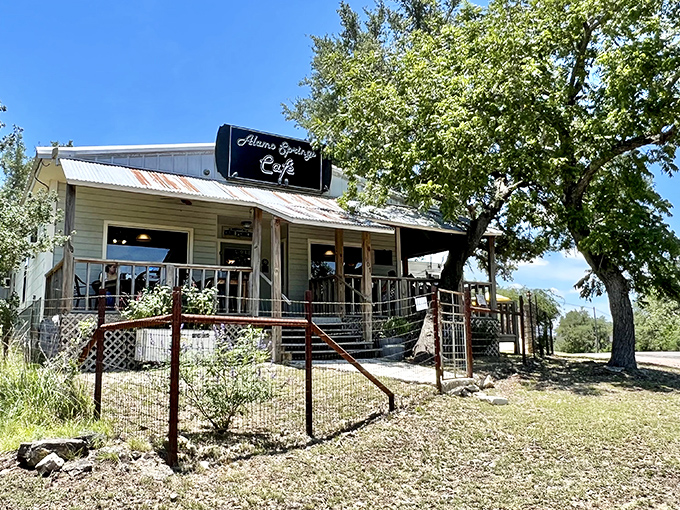 The rustic charm of Alamo Springs Caf&eacute; welcomes hungry travelers with its shady trees and inviting porch &ndash; Texas hospitality in architectural form.
