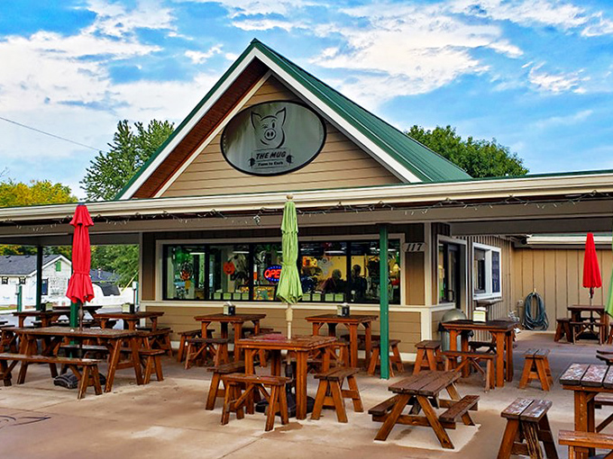 The unassuming exterior of The Mug proves once again that the best food experiences often hide behind the simplest facades. That wooden picnic table is calling your name.