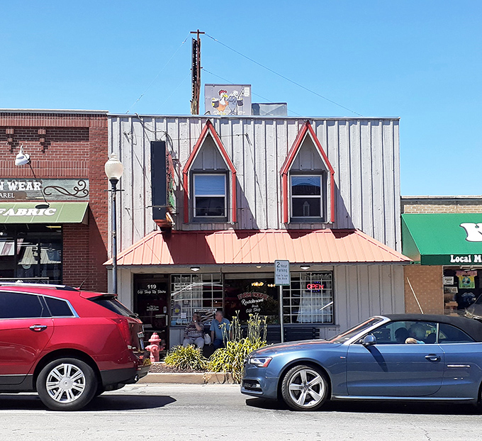 A second view of the charming storefront reveals the classic red-roofed entrance where locals and tourists alike queue up for a taste of authentic Ozark cooking.
