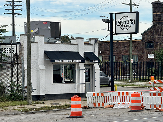 The unassuming white brick facade of Motz's hides culinary greatness like Clark Kent's glasses hide Superman. Famous 100% beef sliders await inside.