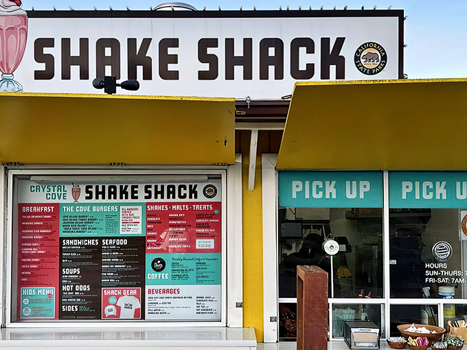 The sunshine-yellow facade of Crystal Cove Shake Shack stands like a beacon of hope for hungry travelers along PCH, promising milkshake salvation and burger bliss.