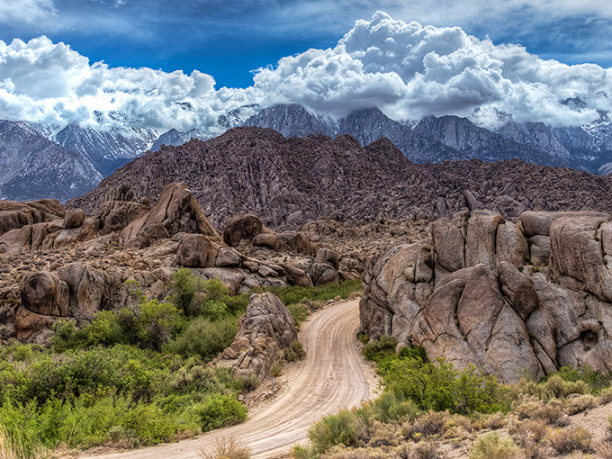 Nature's own Hollywood backlot where that dirt path has starred in more Westerns than John Wayne. The Sierra Nevadas provide the ultimate dramatic backdrop.