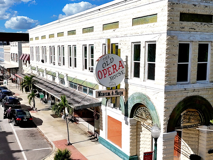 The Old Opera House stands as Arcadia's crown jewel, its vintage sign beckoning visitors into a world where history and commerce dance together beautifully.
