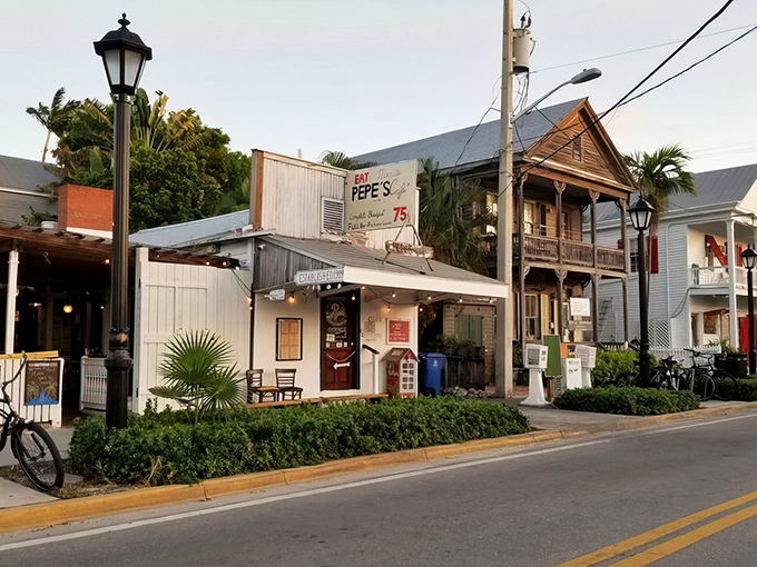 The unassuming exterior of Pepe's Cafe stands as a time capsule on Caroline Street, where Key West's colorful history meets its laid-back present.