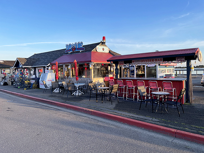 The coastal dream realized: Tony's Crab Shack's red-roofed exterior promises seafood paradise with its weathered charm and inviting outdoor seating.