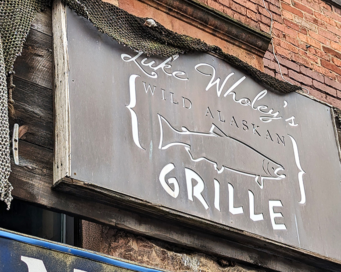 The iconic blue awning of Luke Wholey's beckons seafood lovers like a maritime lighthouse in Pittsburgh's bustling Strip District.