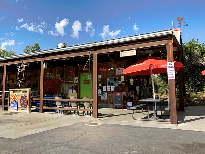 Rustic charm meets culinary magic at this unassuming roadside spot. The weathered metal roof and picnic tables promise an authentic Arizona experience without pretense.