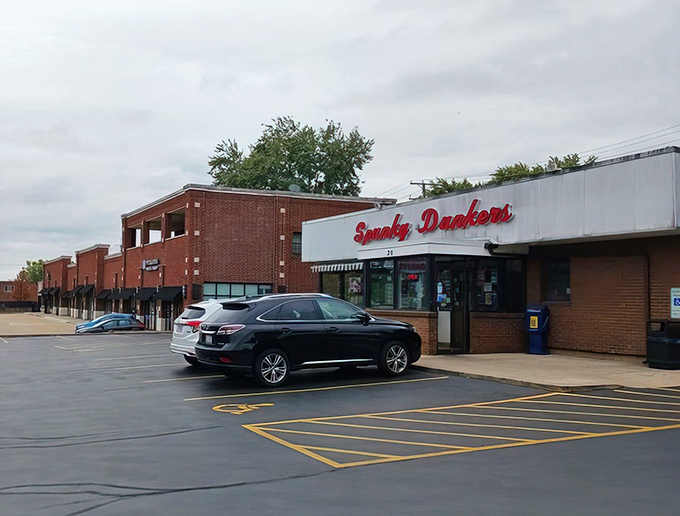 The unassuming storefront of Spunky Dunkers stands like a sugar-filled oasis in suburban Palatine, its iconic red script promising sweet salvation to all who enter.