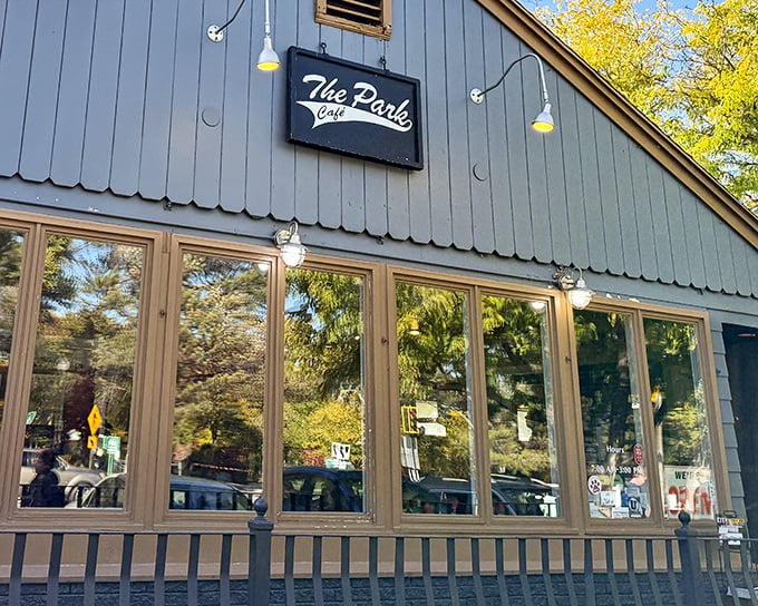 The blue exterior of The Park Café stands like a humble guardian of breakfast dreams, promising culinary magic within its unassuming walls.